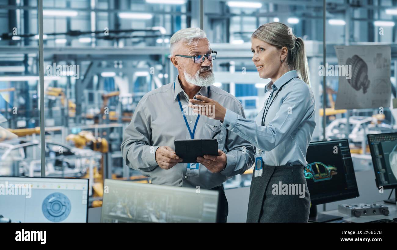 Car Factory: Female Project Manager Talks to Male Automotive Engineer ...