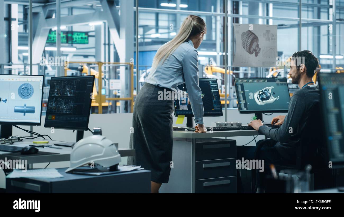 Car Factory Office: Project Manager Talks to Engineer Working on ...