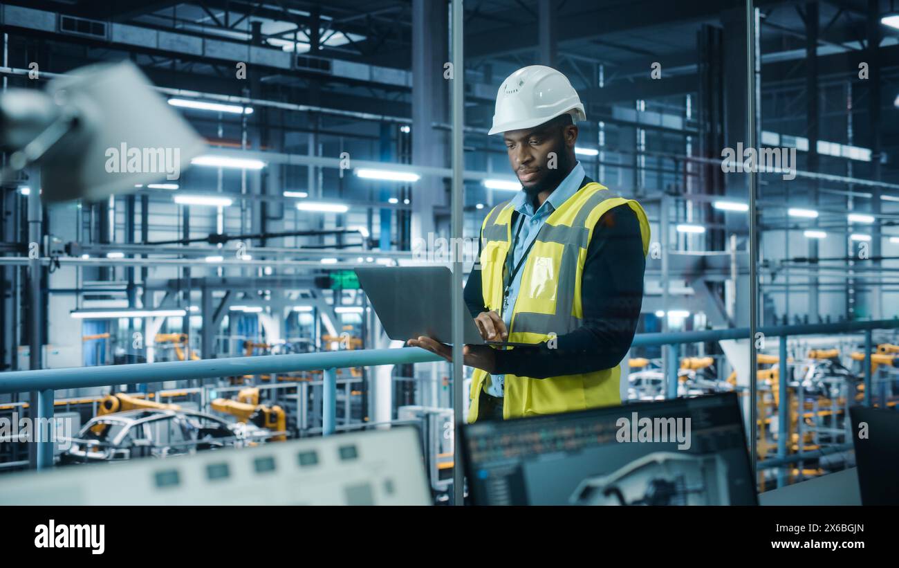 Car Factory: Professional Male Automotive Engineer Wearing Hard Hat ...