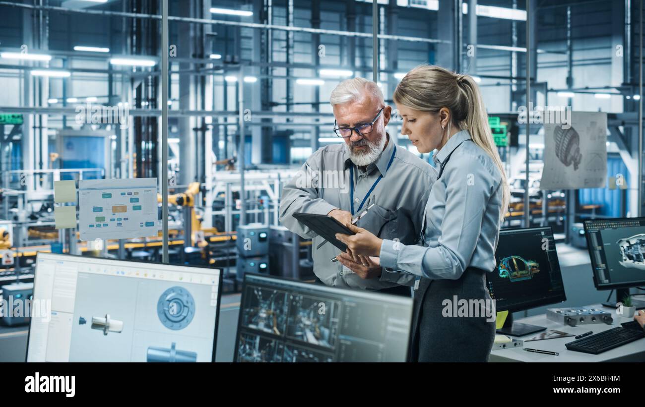 Car Factory Office: Manager Talks with Senior Engineer, Use Tablet ...