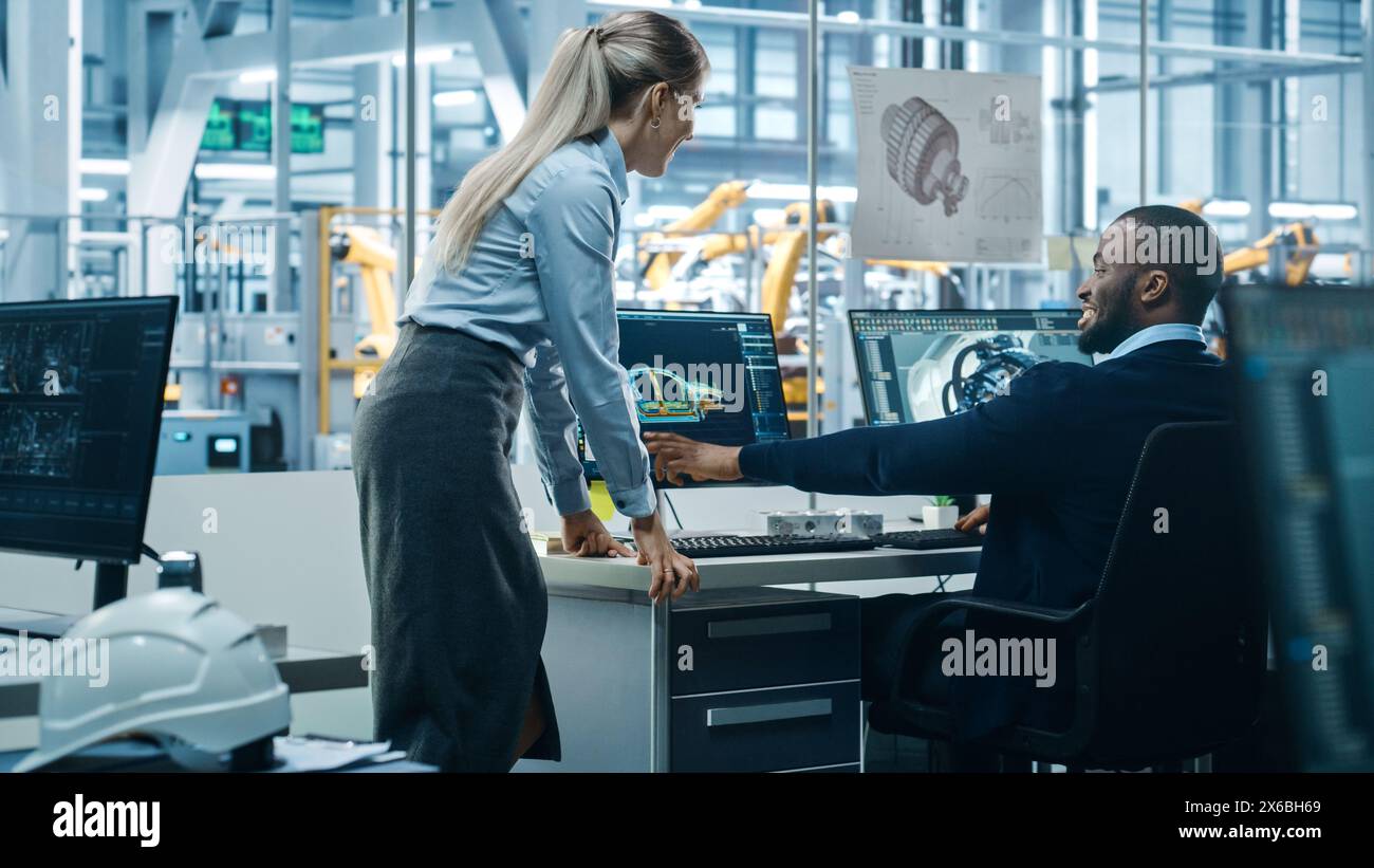 Car Factory Office: Project Manager Talks to Engineer Working on ...