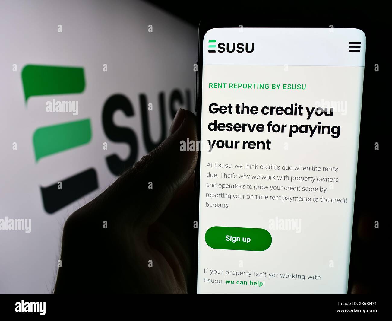 Person holding cellphone with webpage of US financial technology ...