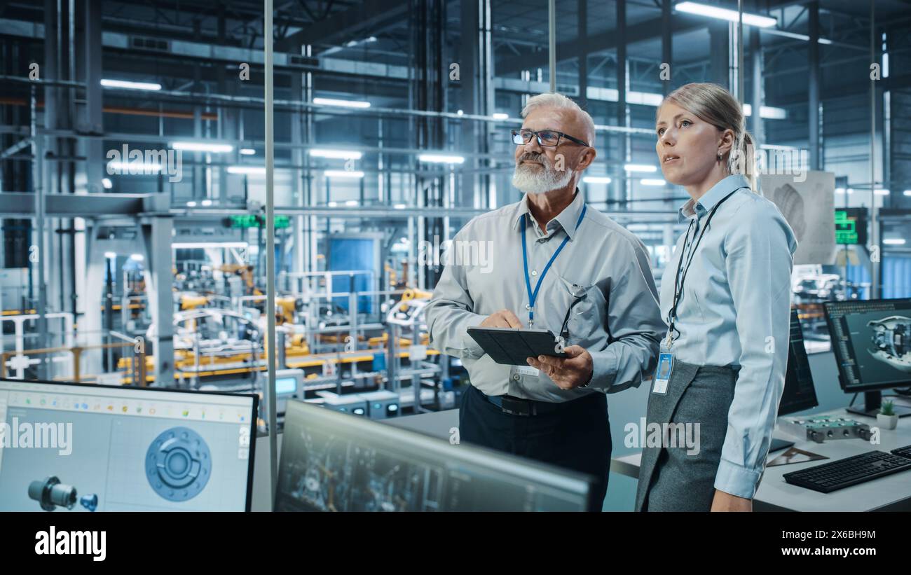 Car Factory: Female Project Manager Talks to Male Automotive Engineer ...