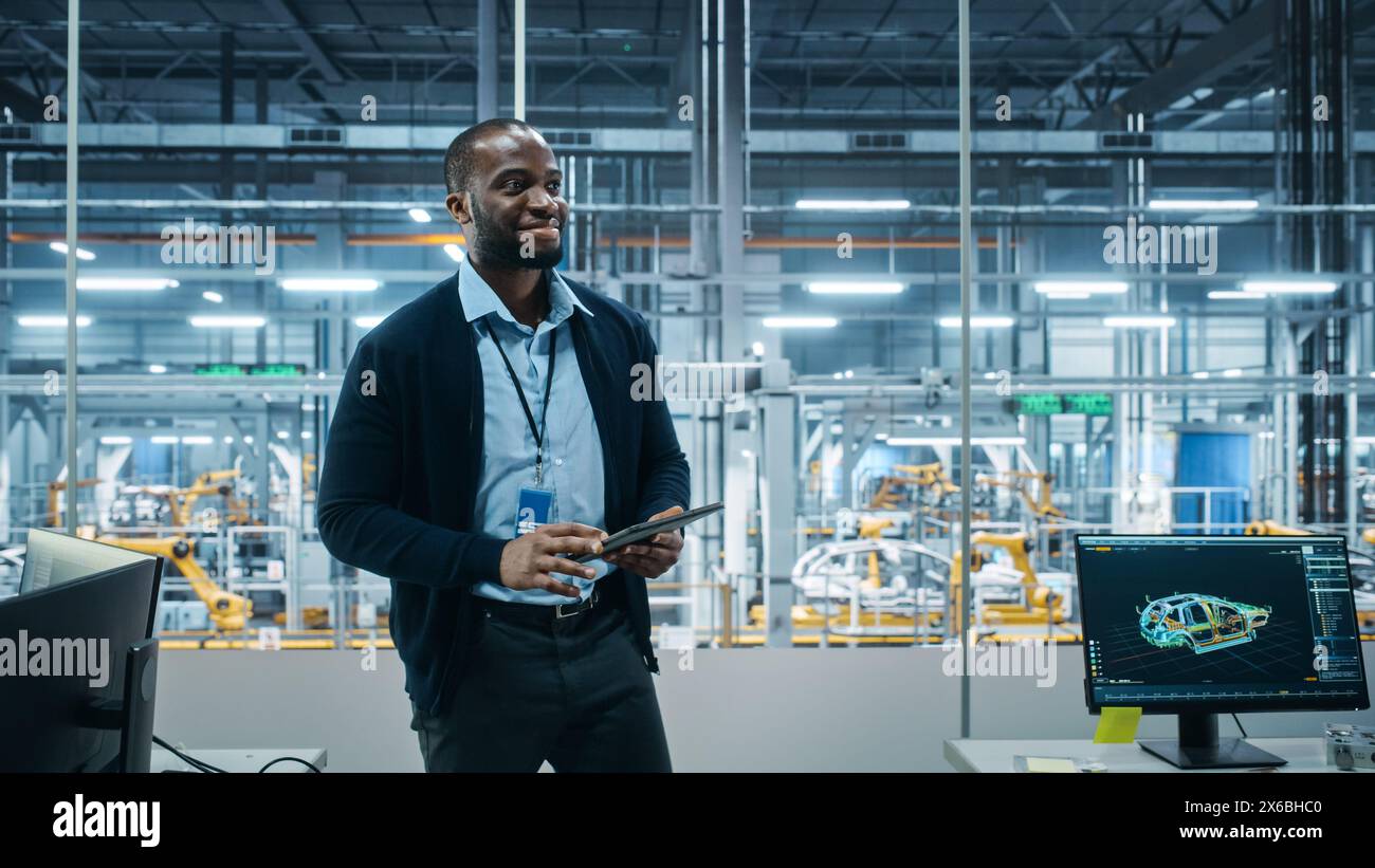 Car Factory Office: Successful Male Chief Engineer Overlooking Factory ...