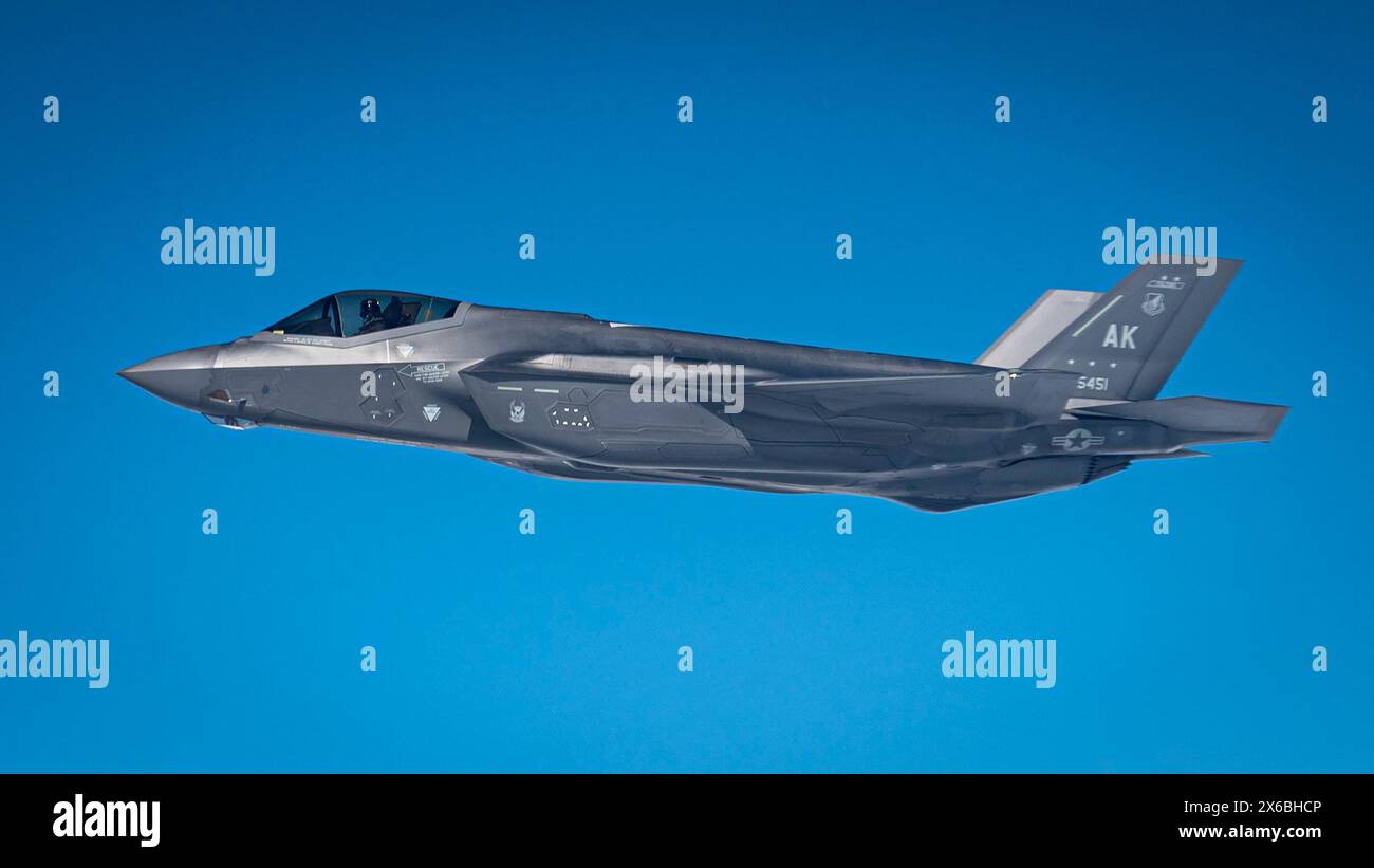 An F-35 Lightning II aircraft, assigned to the 354th Fighter Wing, fly ...