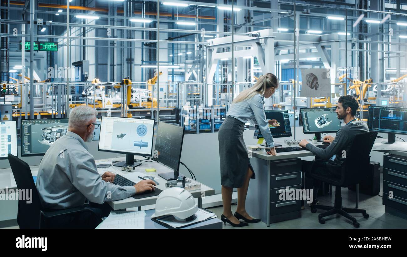 Car Factory Office: Project Manager Talks to Engineer Working on ...