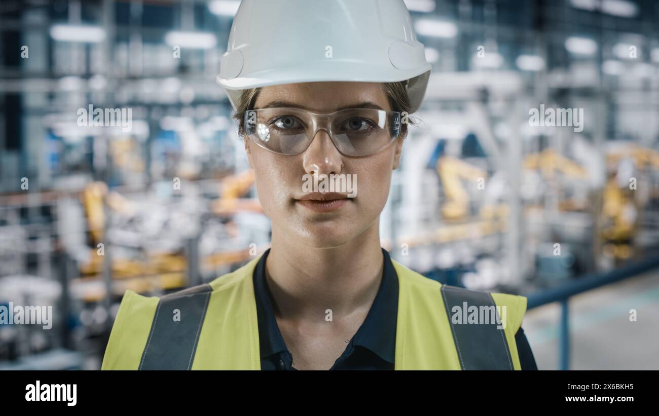 Portrait of Female Automotive Industry Engineer Putting on Safety ...