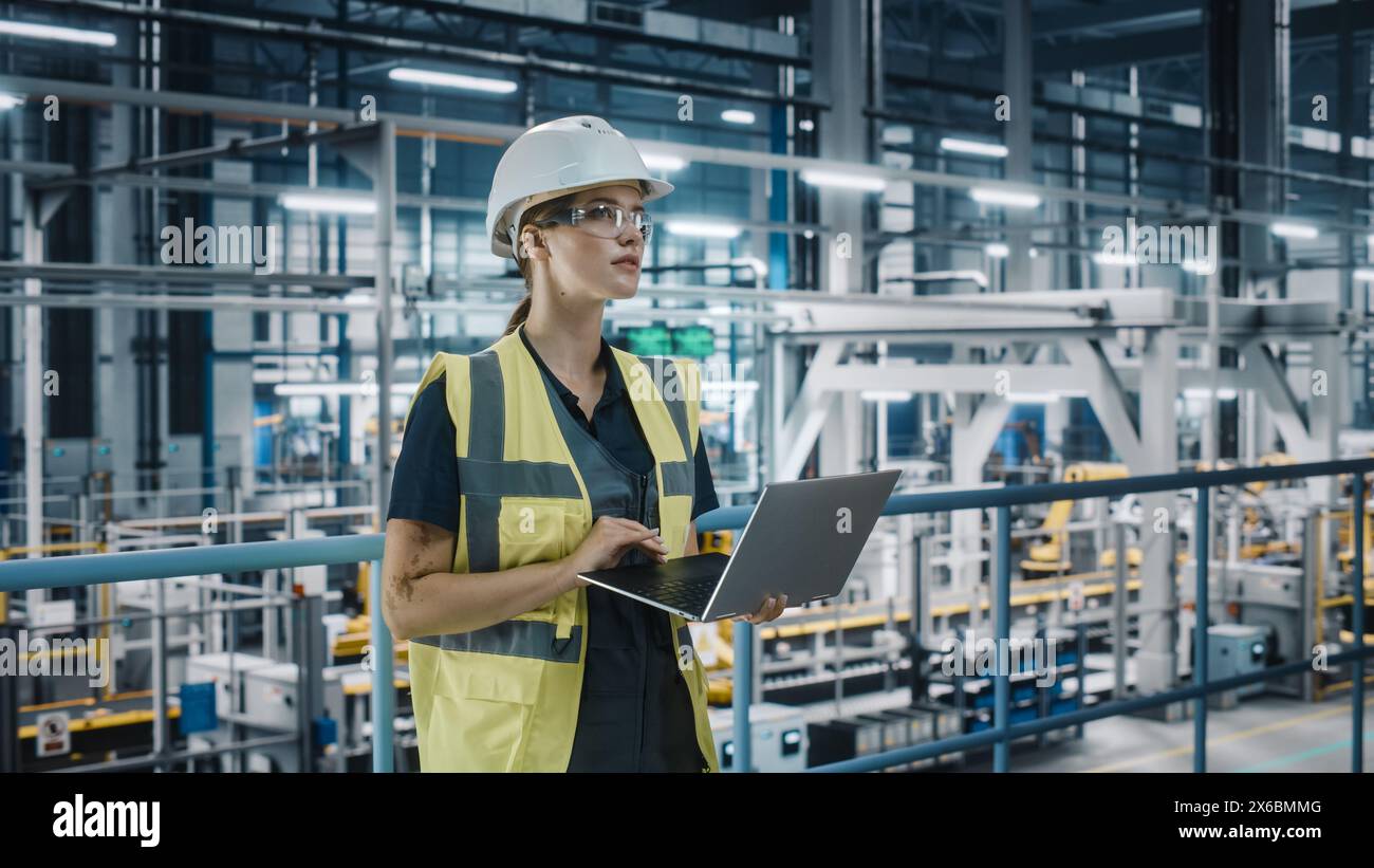 Portrait of Female Automotive Industry 4.0 Engineer in Safety Uniform ...