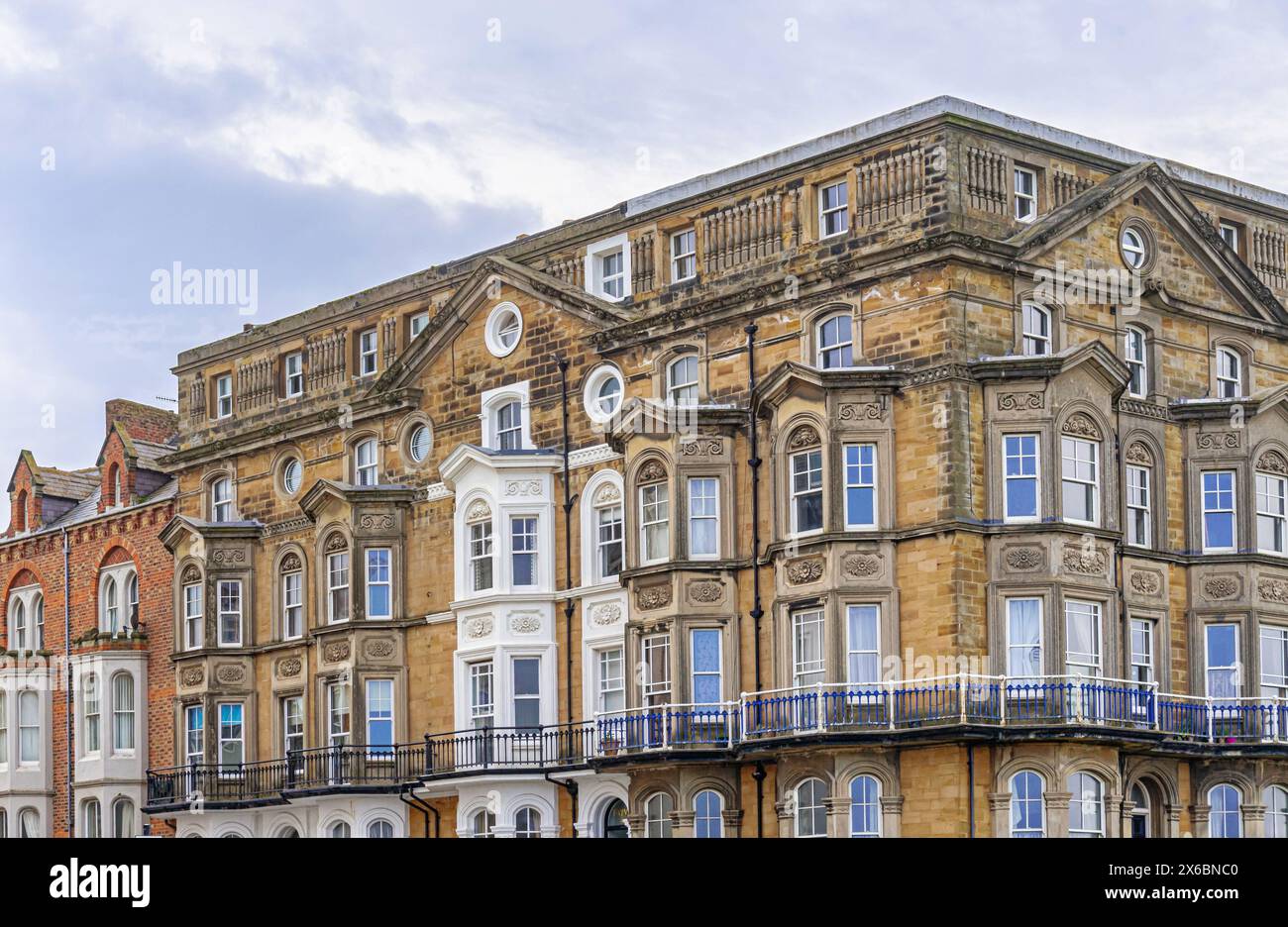 Victorian style building comprised of apartments in a seaside town. A ...