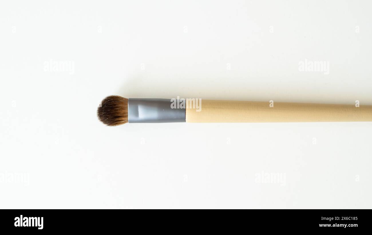 Wooden organic makeup brushes on white backdrop. Eco-friendly ...