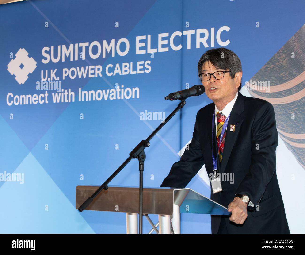 EDITORIAL USE ONLY Osamu Inoue President of Sumitomo Electric Group speaking at the Sumitomo ...