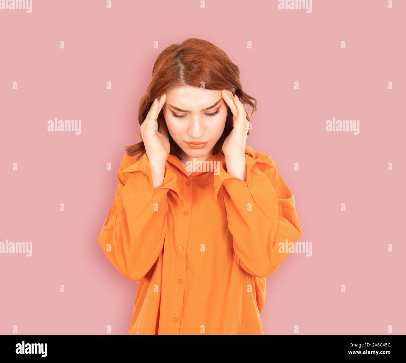 Frustrated caucasian red hair woman hold hands head temple. Young pretty girl unhappy, headache ...