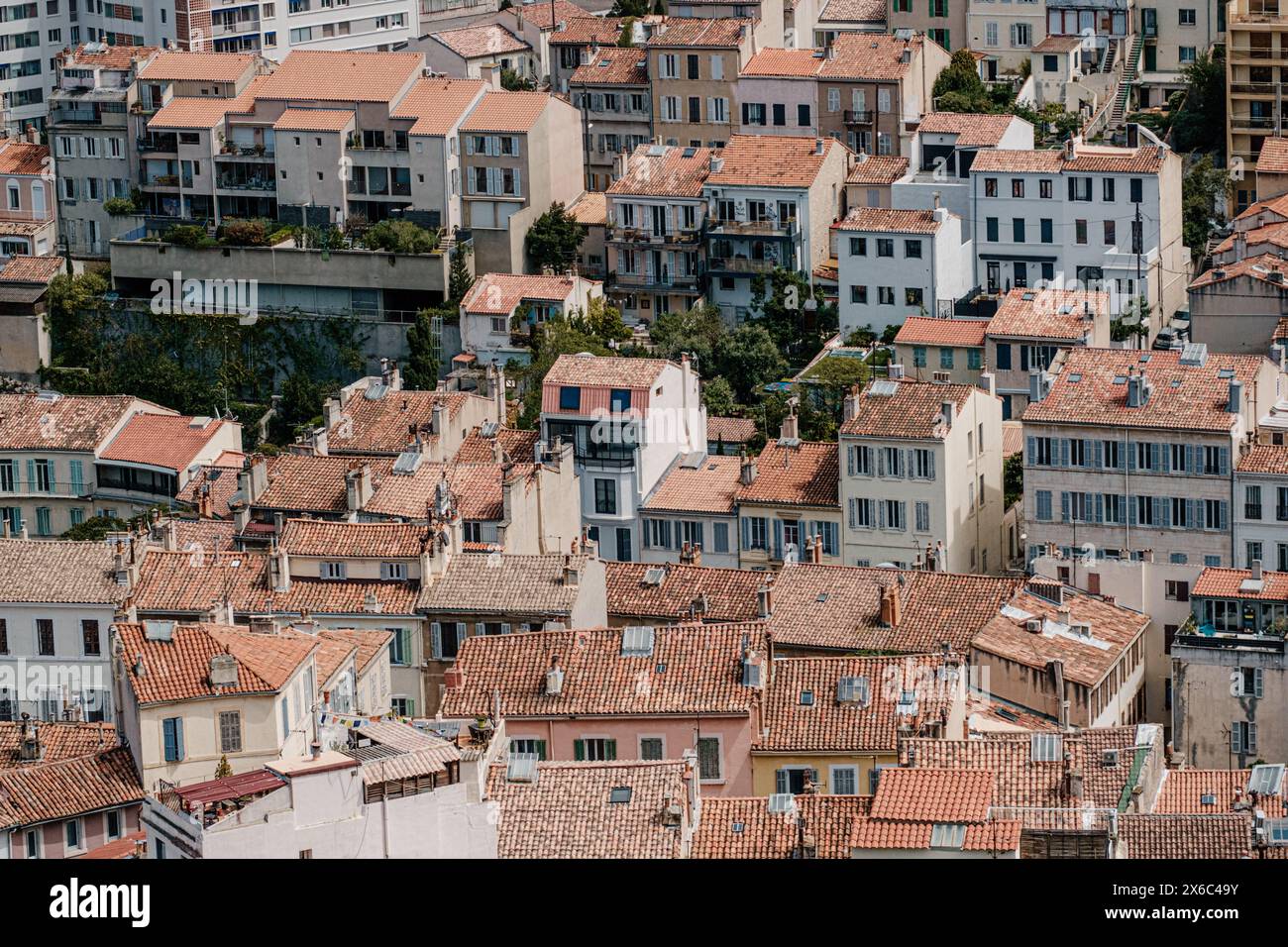 Dense urban area in Marseille, terracotta rooftops and greenery Stock ...