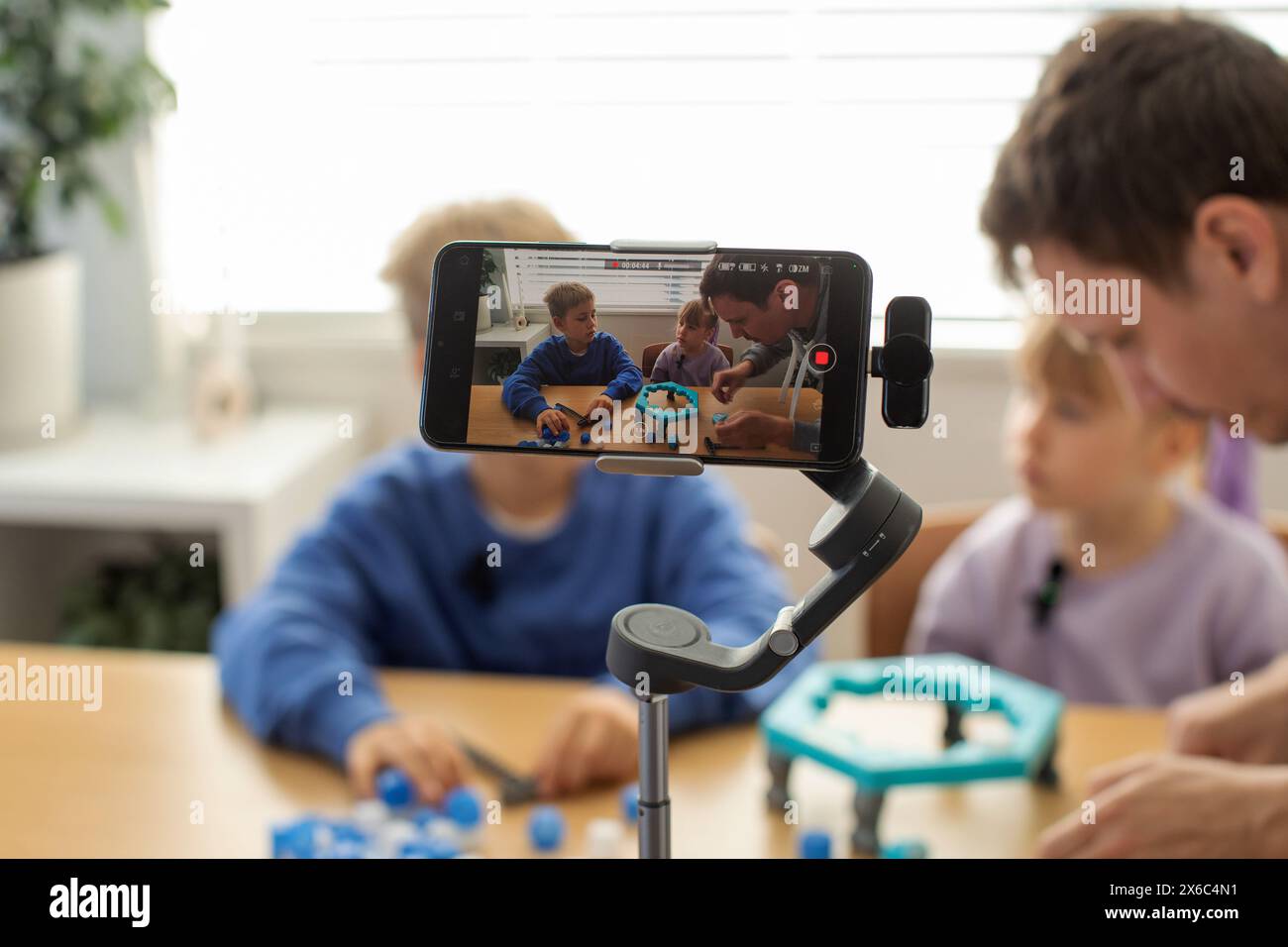 Kids play a new board game for their blog, recording a fun and ...