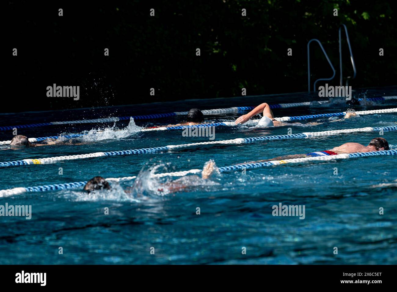 14 May 2024, Berlin: Swimmers in the sports pool at the Kreuzberg ...