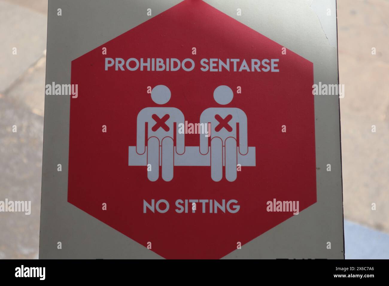 Spanish notice board where seating is prohibited Stock Photo - Alamy