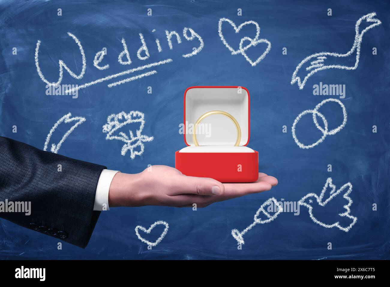 Wedding concept with a hand holding a ring box Stock Photo - Alamy