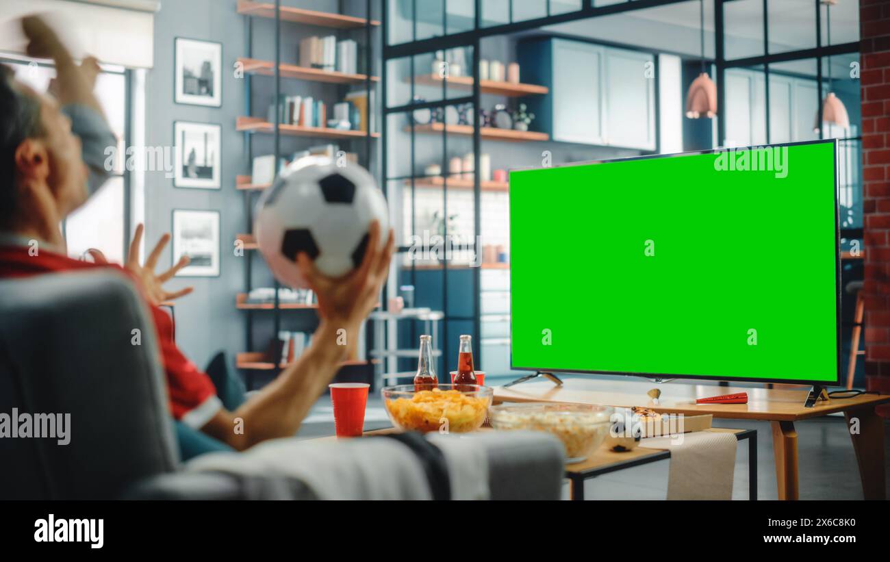 At Home Joyful Soccer Fans Sit on a Couch Watch Green Screen Chroma Key ...