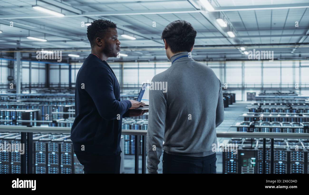 System administrators in data center hi-res stock photography and ...