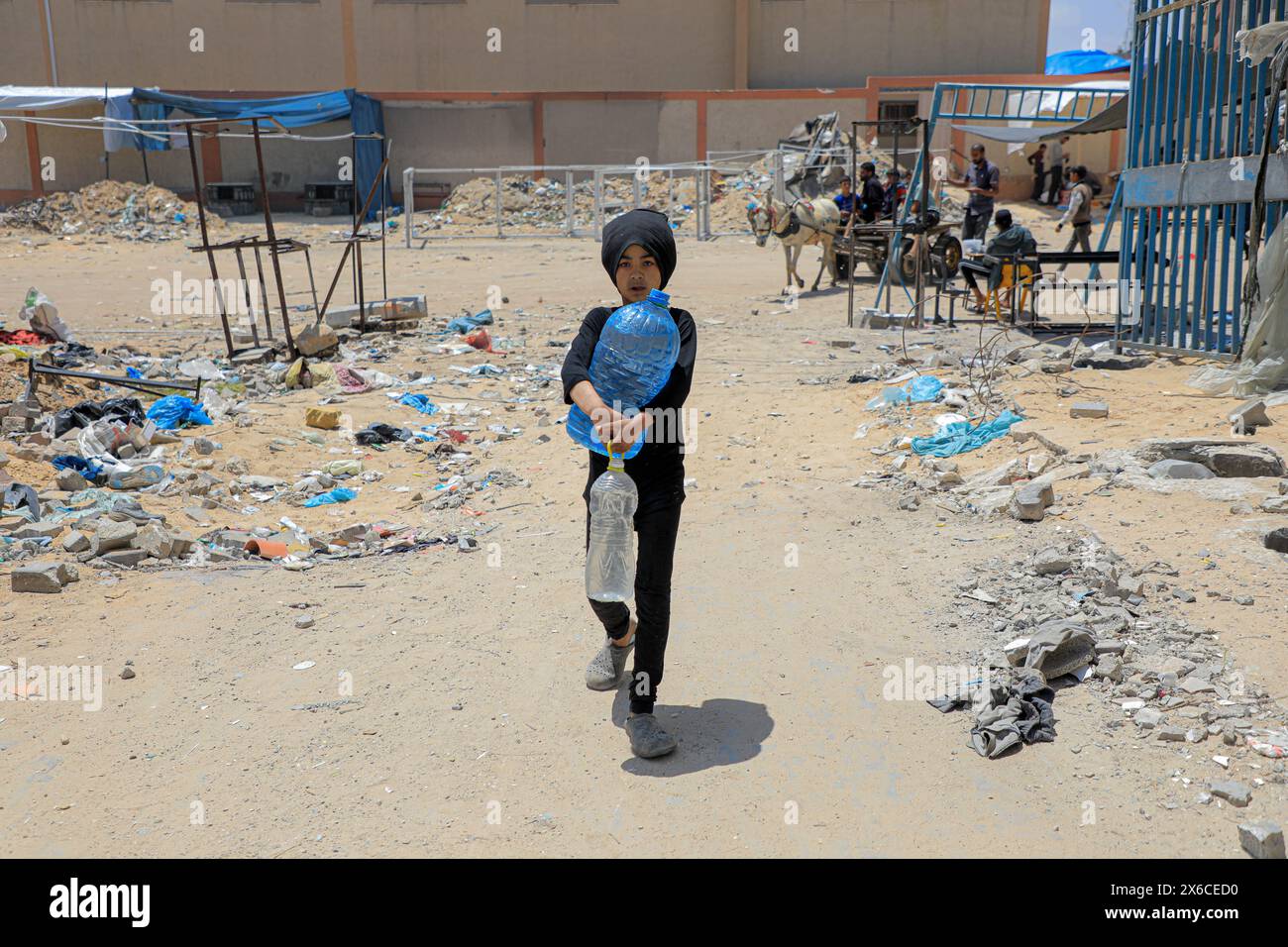 Khan Younis. 13th May, 2024. A Palestinian child fetches water at a ...