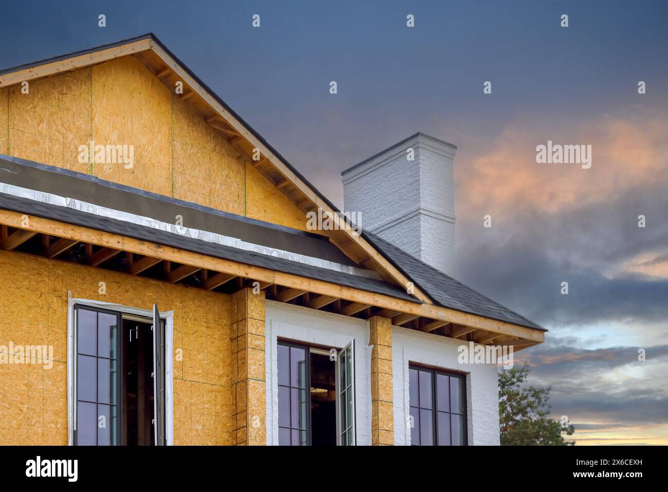 An under construction house has joist framework features plywood ...