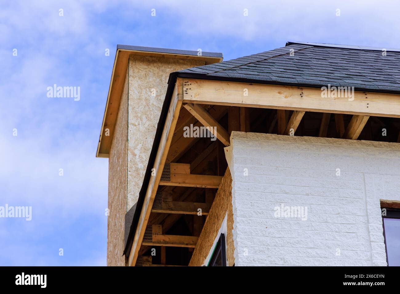 As house is under construction, joist framework gutter holders soffit ...