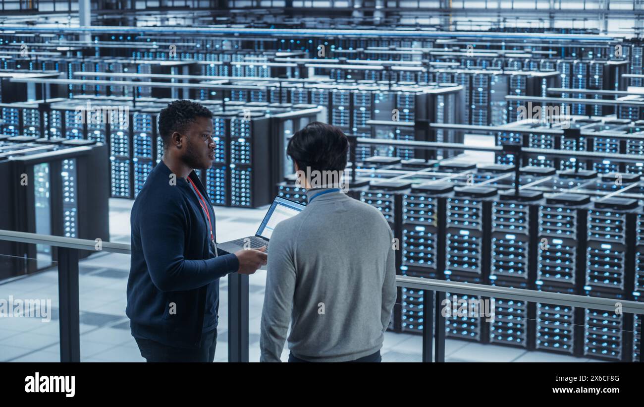 Data center two specialists talk hi-res stock photography and images ...