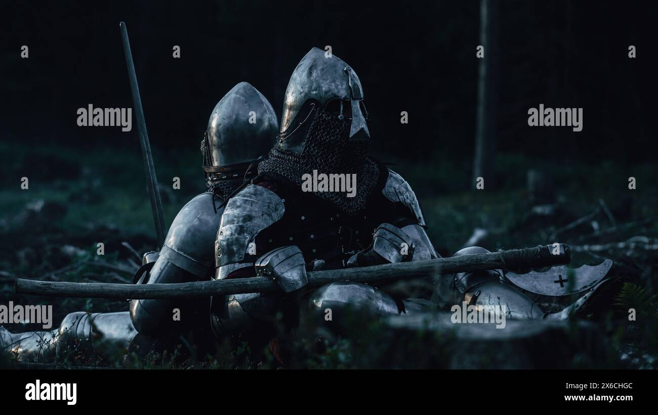 Two Medieval Knights Sitting on Battlefield amidst Dead Enemies. Last ...