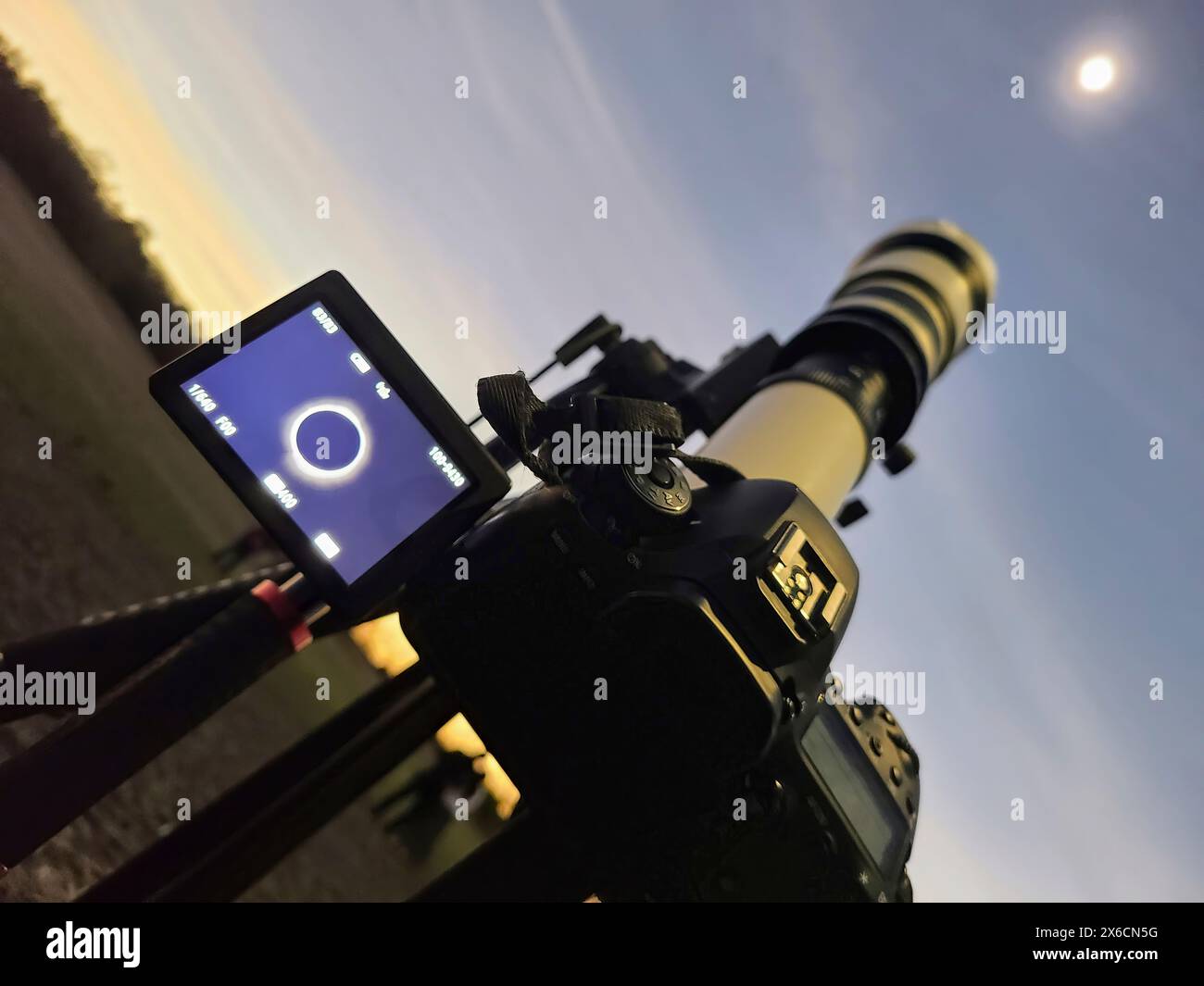 Camera Capturing Solar Eclipse with Telephoto Lens at Twilight Stock ...