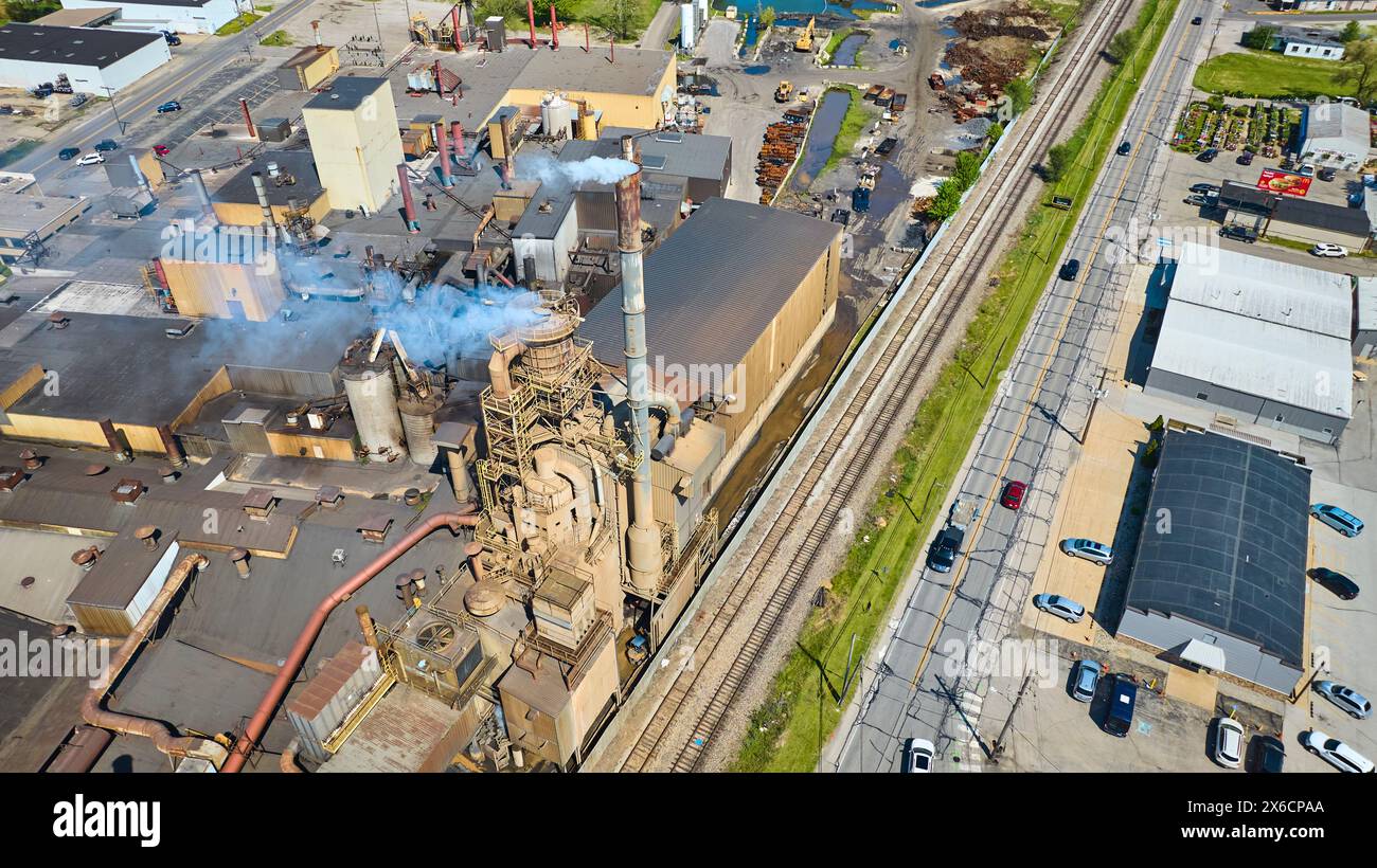 Aerial View of Busy Industrial Factory with Smokestacks and Urban ...