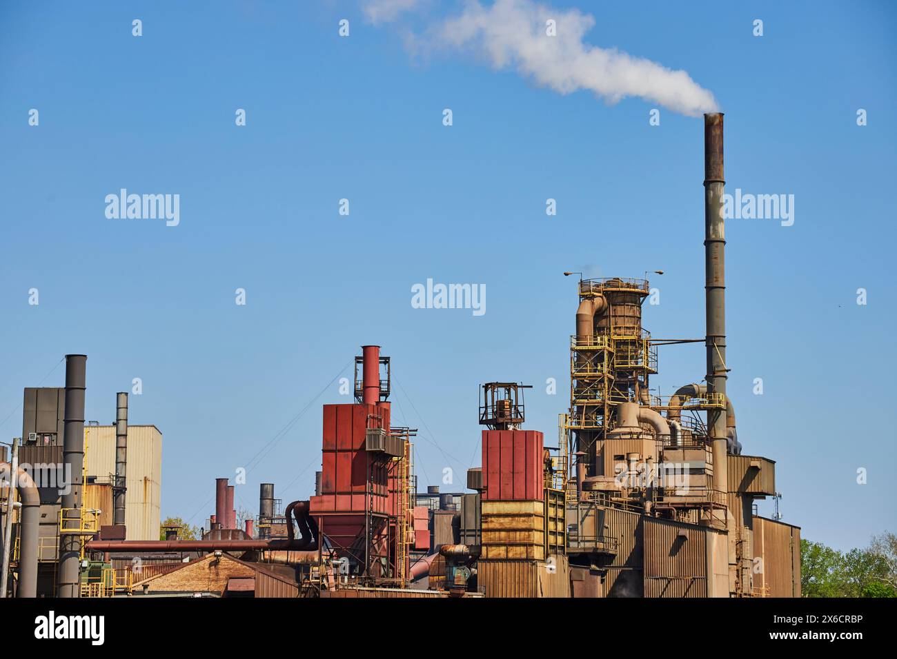 Industrial Plant with Smokestacks and Rusty Metal Surfaces, Eye-Level ...