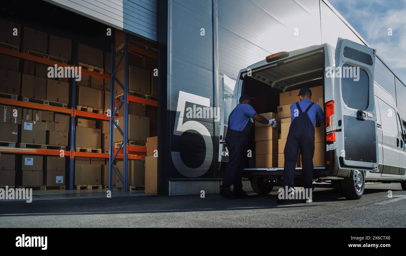 Outside of Logistics Distributions Warehouse: Two Workers Load Delivery ...