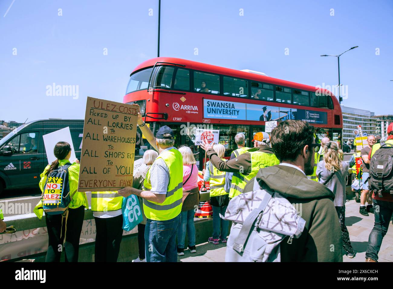 Banners and placards are seen as participants gather for an anti-ULEZ ...