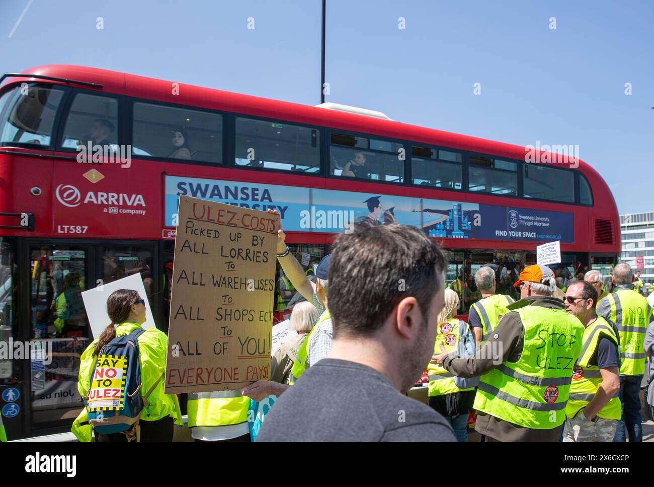 Banners and placards are seen as participants gather for an anti-ULEZ ...