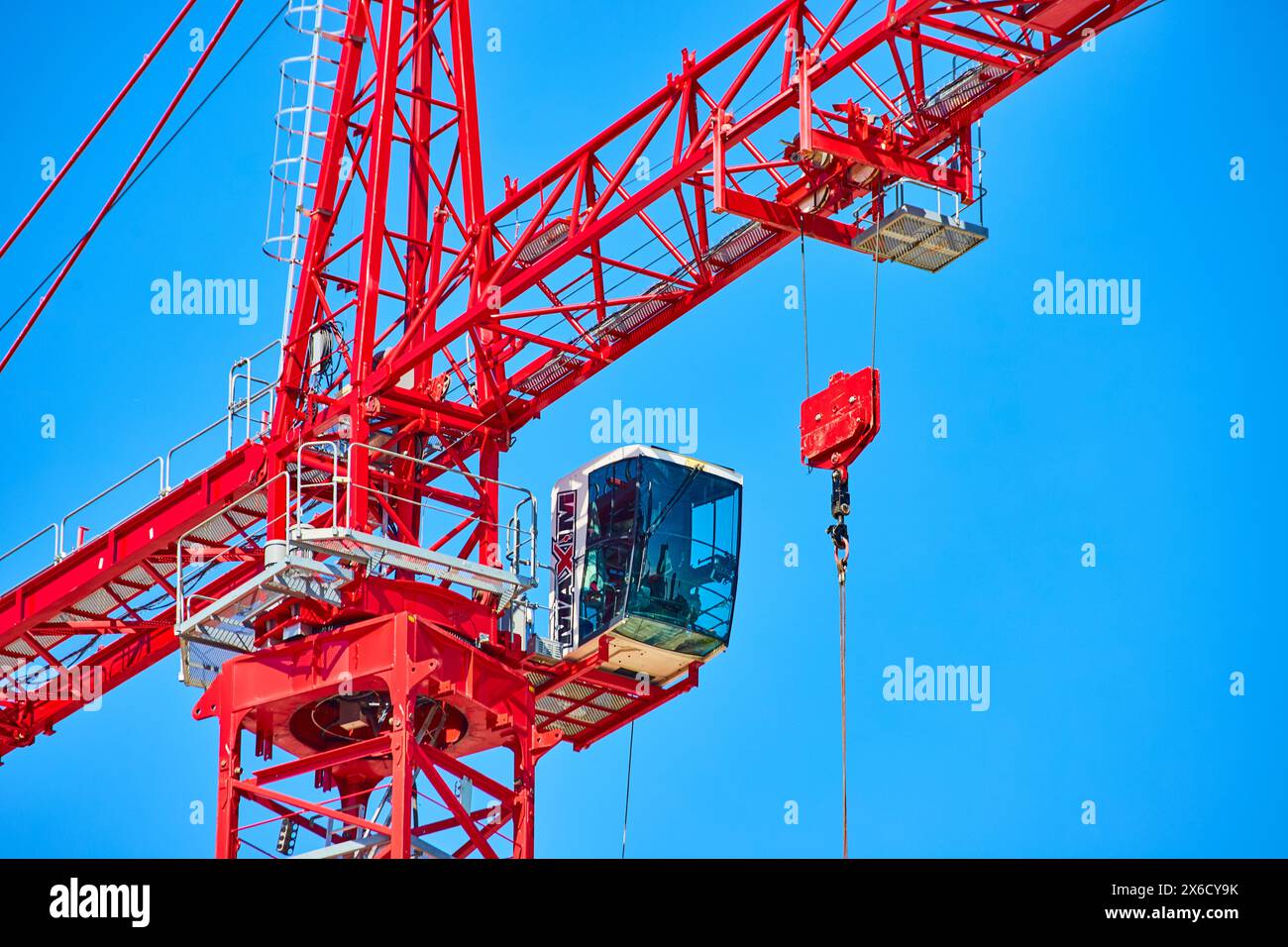Red Construction Crane in Urban Development, Eye-Level View Stock Photo ...