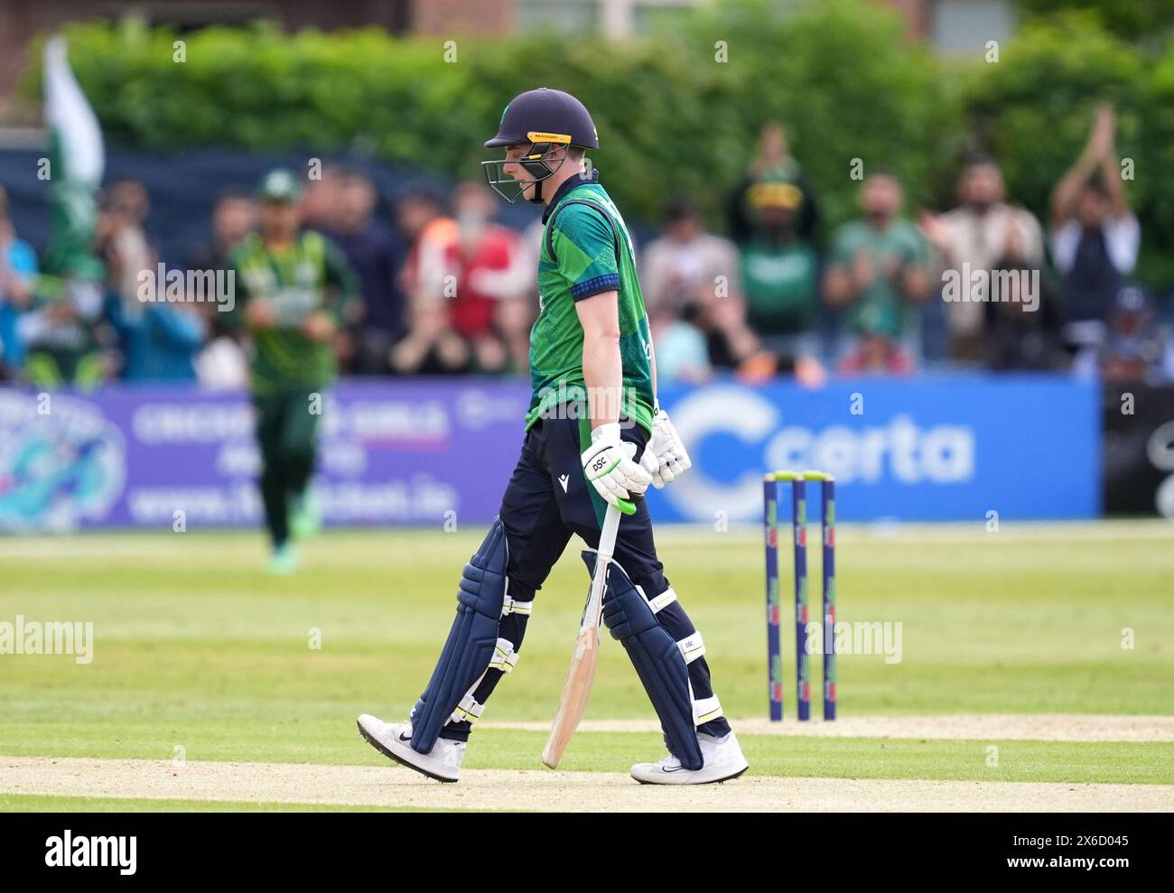 Ireland's Lorcan Tucker walks after being caught out by Pakistan's Saim ...