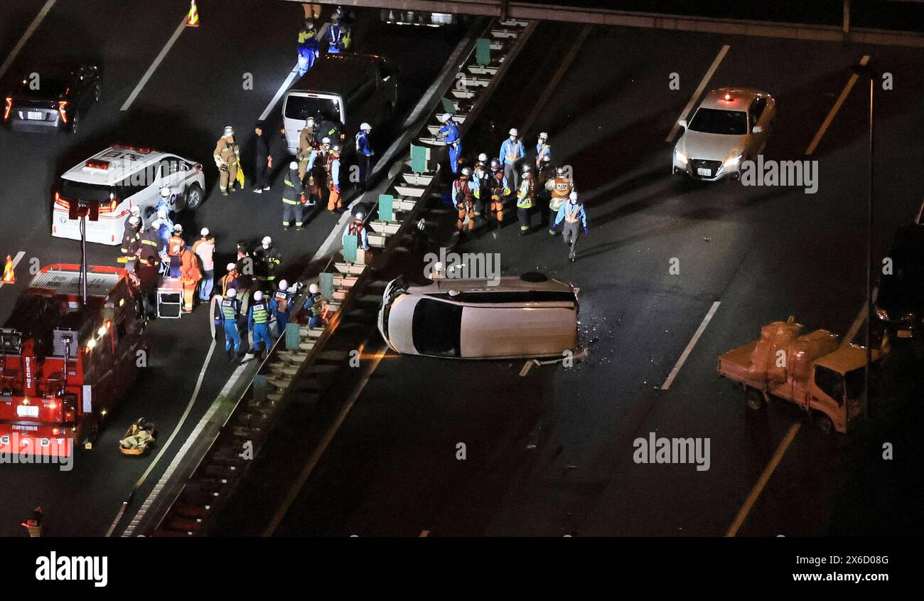 An aerial night photo shows a vehicle crashed at the Wangan Bayshore ...
