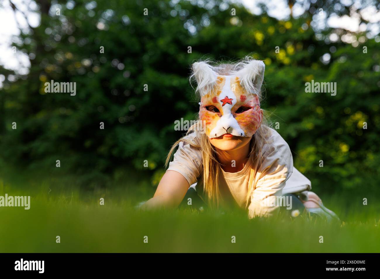 Cute young little kid girl wear cat furry mask enjoy have fun playing ...