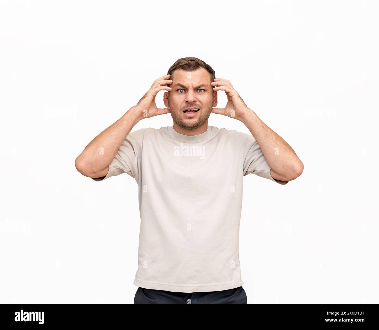 Nonplussed adult man expressing emotions of confusion on white ...