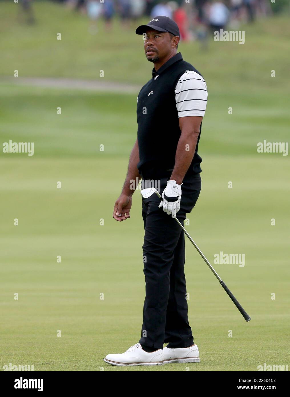 Tiger Woods watches his approach shot on the fifth hole during the ...