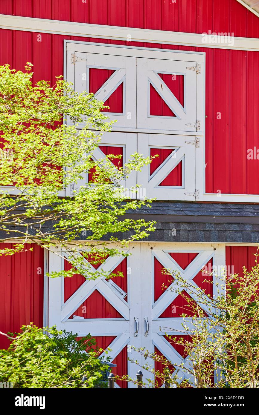 Vibrant Red Barn with White Doors in Rural Spring Setting Stock Photo ...