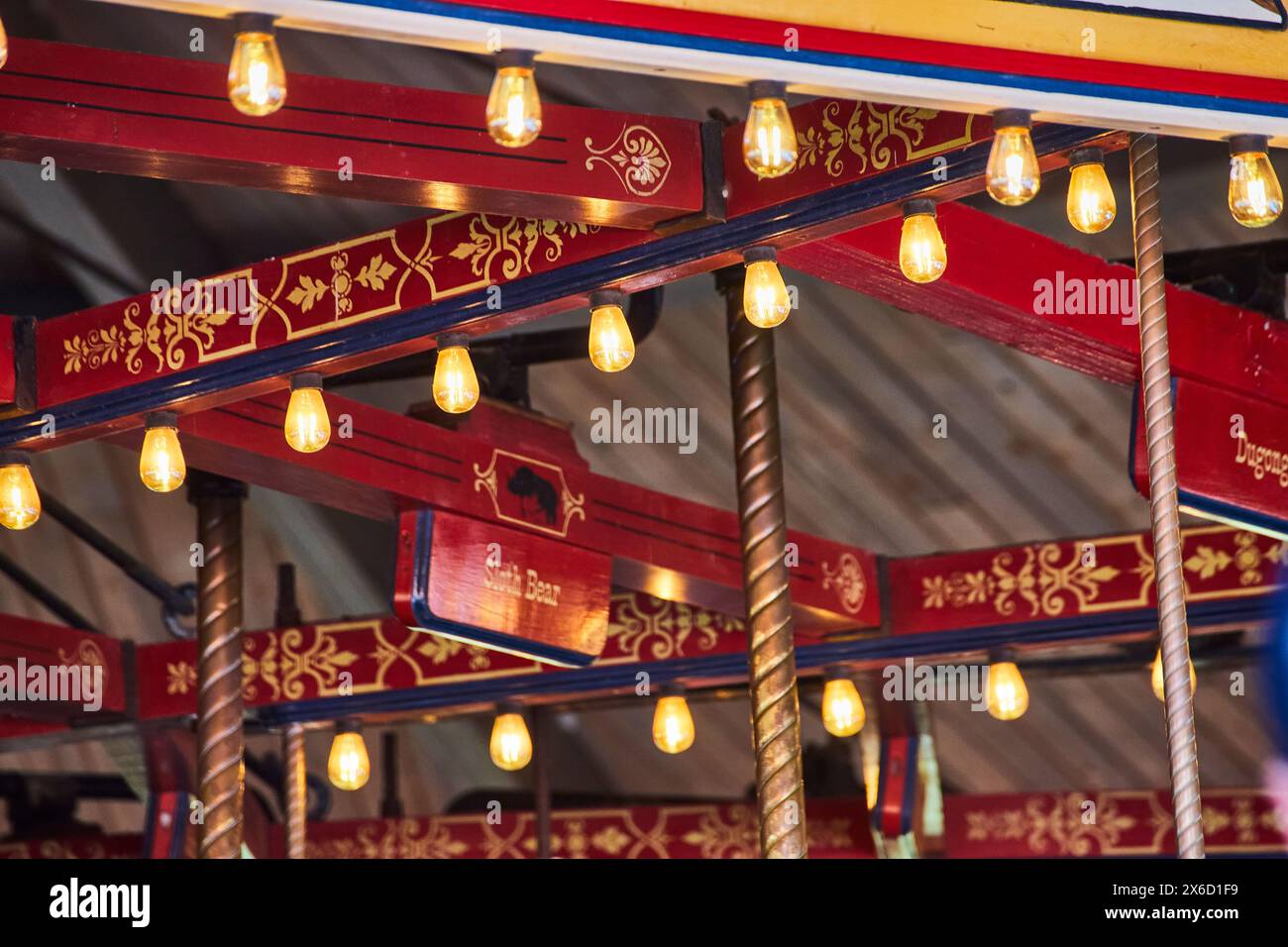 Ornate Carousel Detail with Glowing Bulbs and Diagonal Beams Stock ...