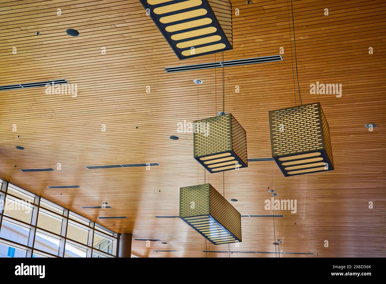 Modern Architectural Interior with Geometric Light Fixtures and Wooden ...
