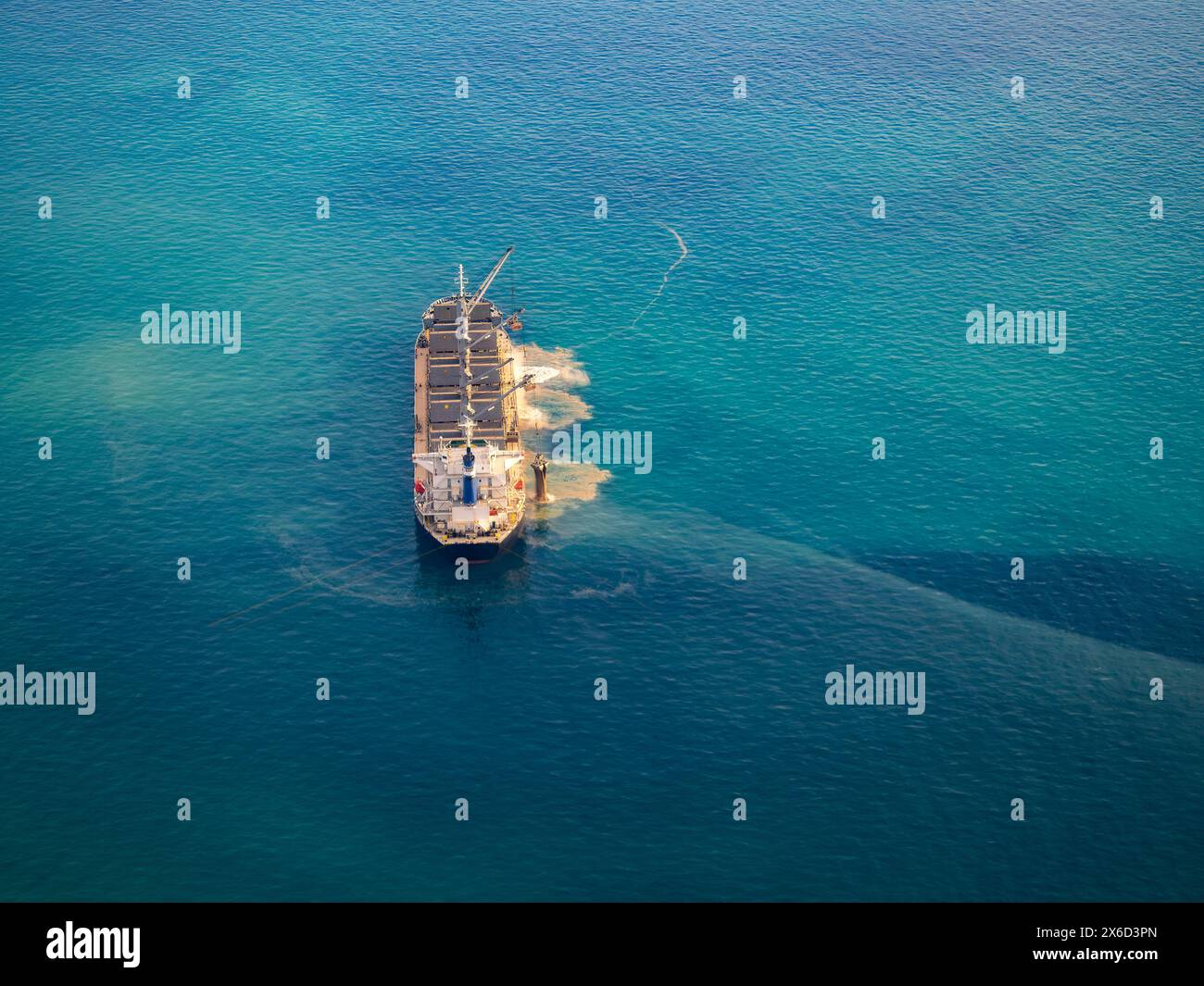 ship Dredging the seabed for the construction of a new dam in front of ...