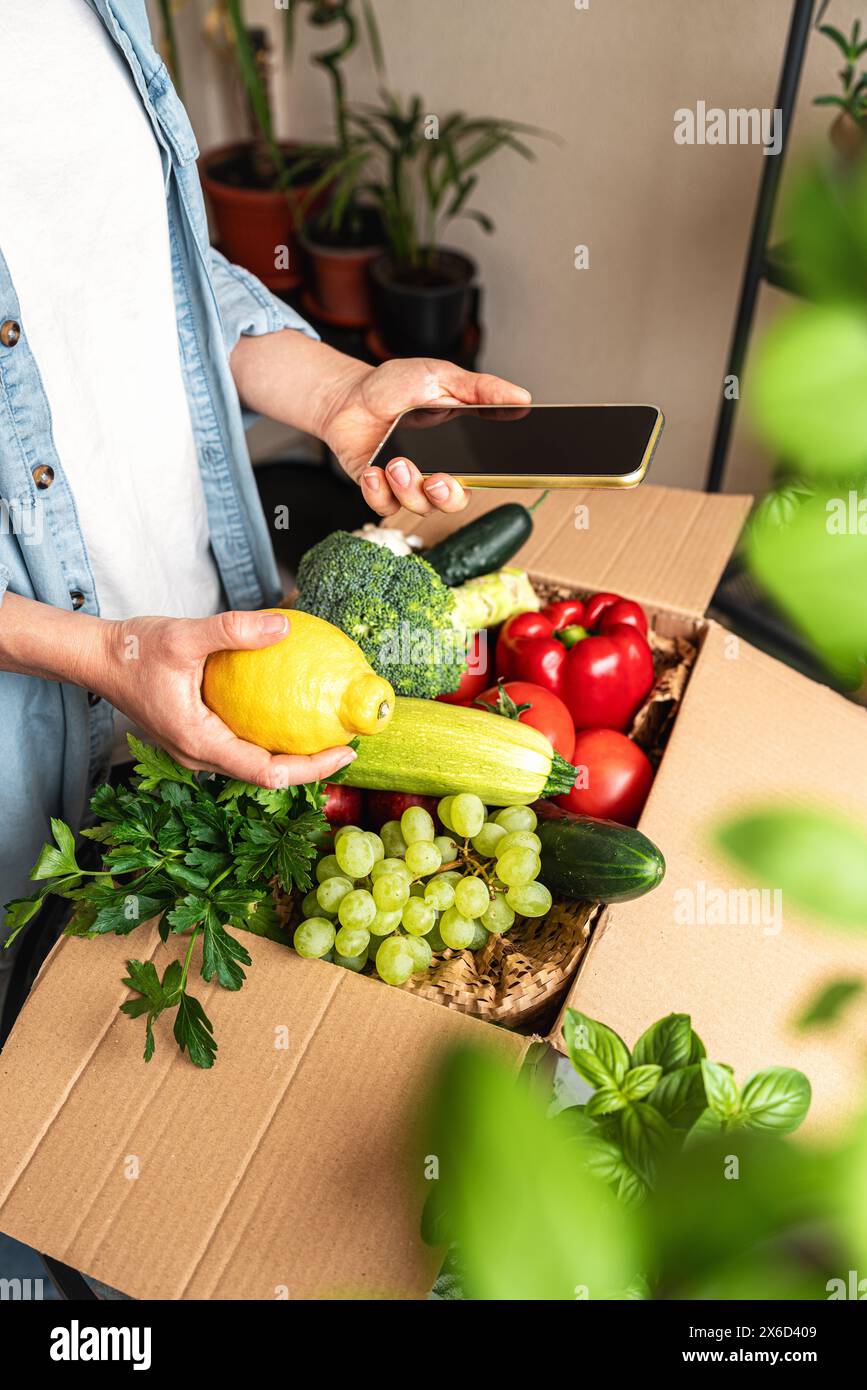 Healthy eating and nutrition. Unpacking online order of farm grown bio ...