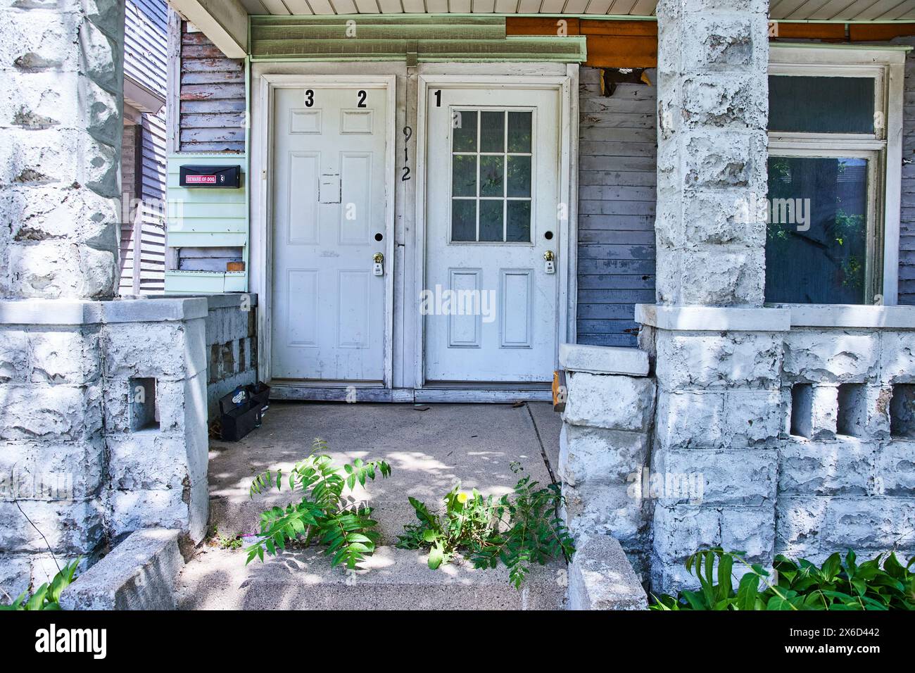 Urban Decay and Aging Doors of Multi-Unit Building, Eye-Level View ...