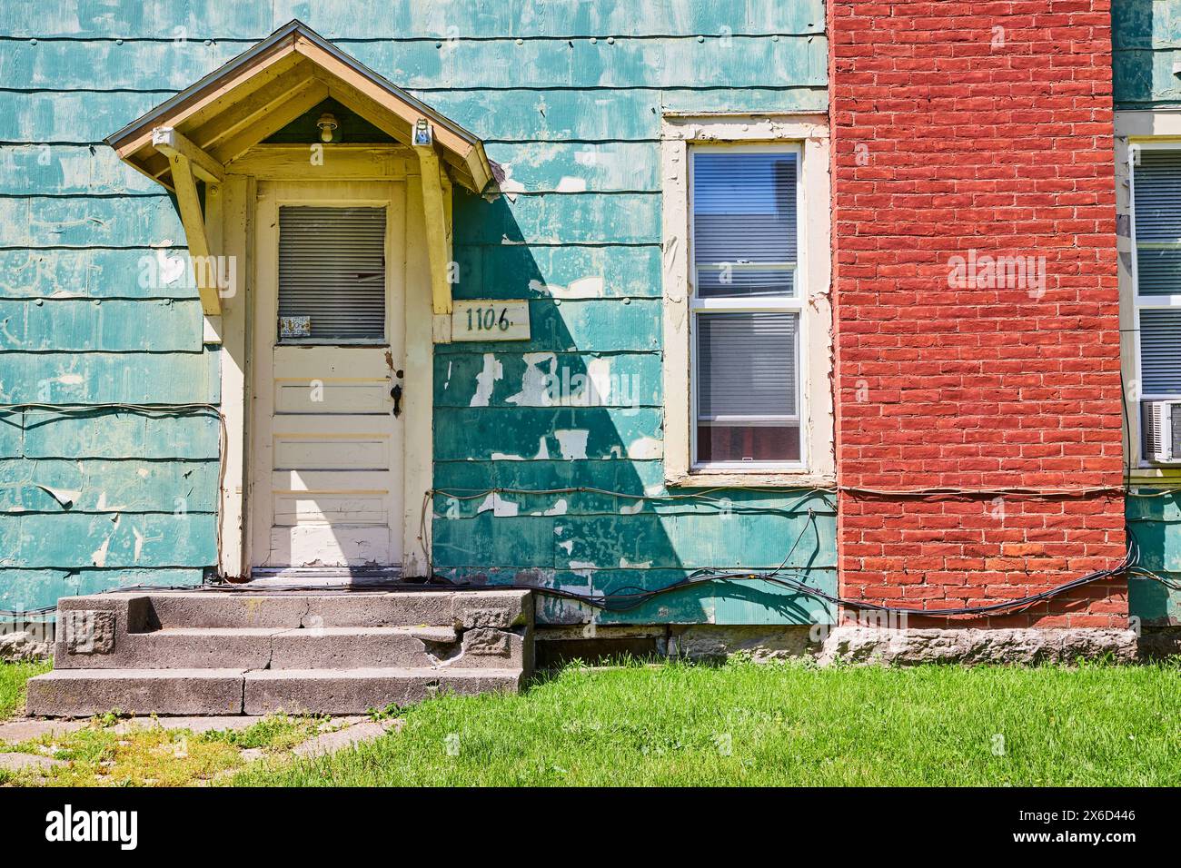 Aged Turquoise Facade and Red Brick Wall, Eye-Level View Stock Photo ...