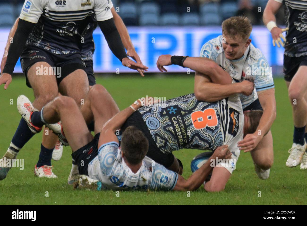 Charlie Cale (C) of ACT Brumbies and Jake Gordon (L), Joey Walton (R ...