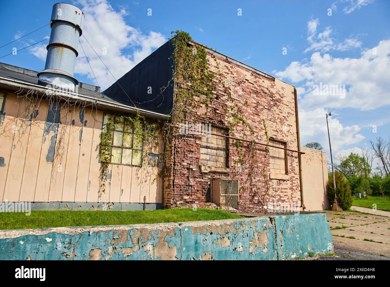 Abandoned Industrial Building with Overgrowth in Sunny Weather Stock ...