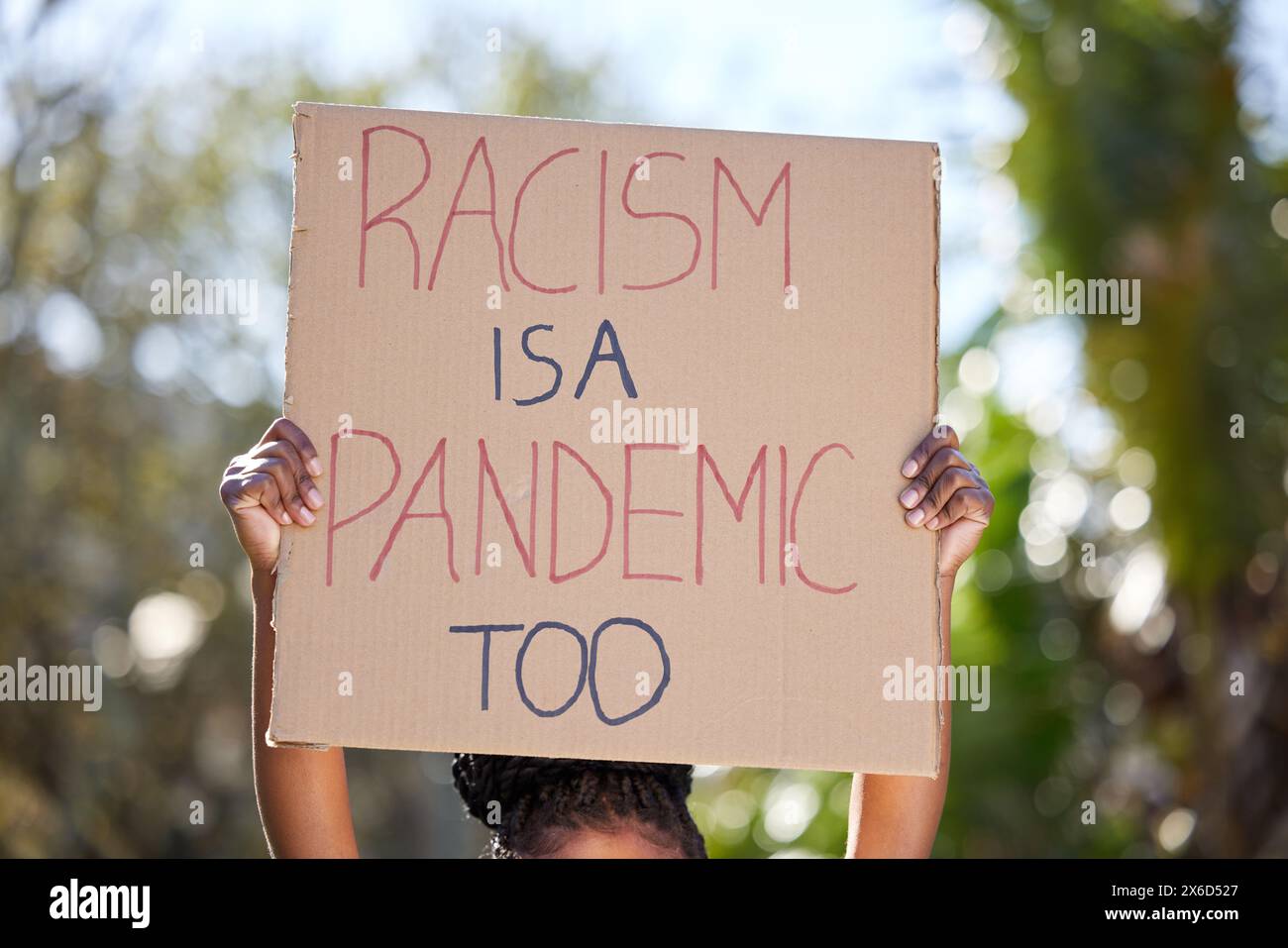 Social justice, activist and African woman with placard, outdoor and ...